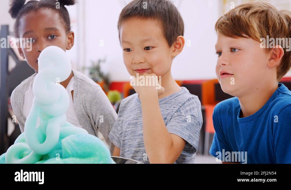School kids watching chemical reaction at a science centre Stock Video ...