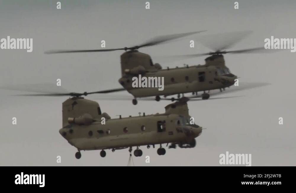 Boeing CH-47 Chinook lift howitzer in mid-air - 2018 Stock Video ...