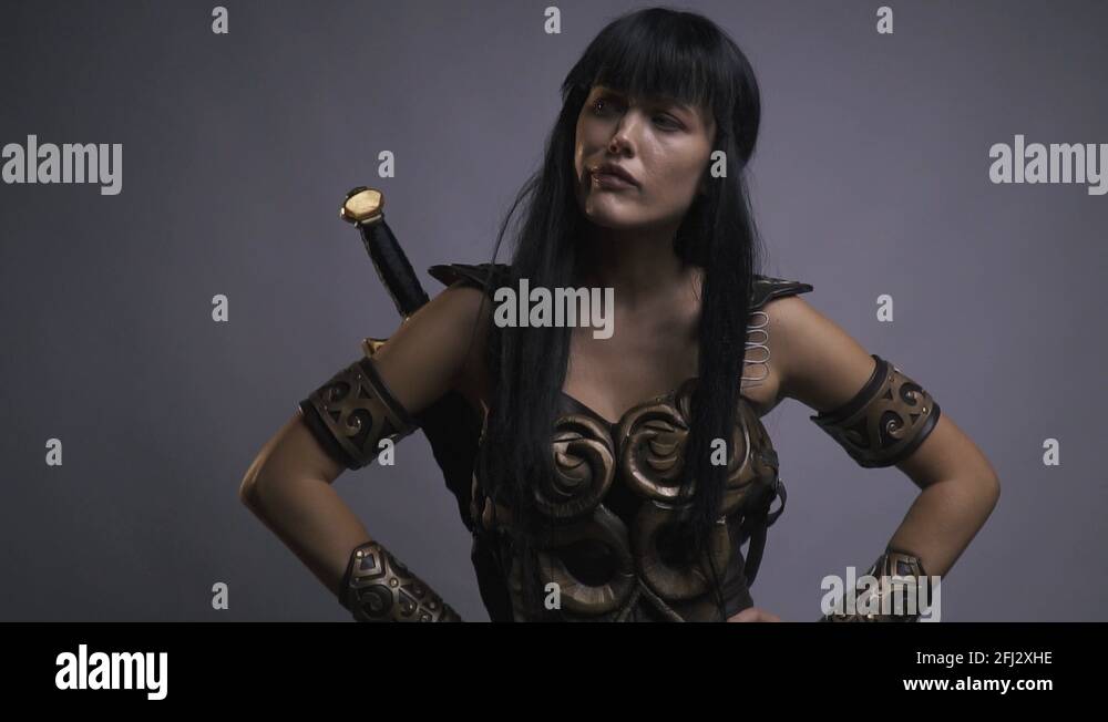 Amazon in armor with a sword and a battle disk waiting comrades, slow ...