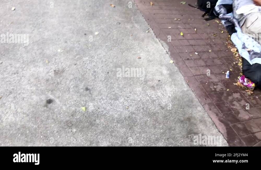 Homeless man sleeping street sidewalk Stock Videos & Footage - HD and ...