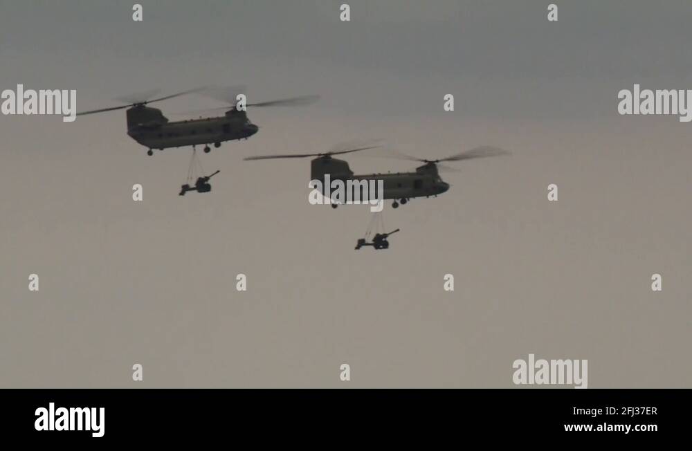 Boeing CH-47 Chinook lift howitzer in mid-air - 2018 Stock Video ...