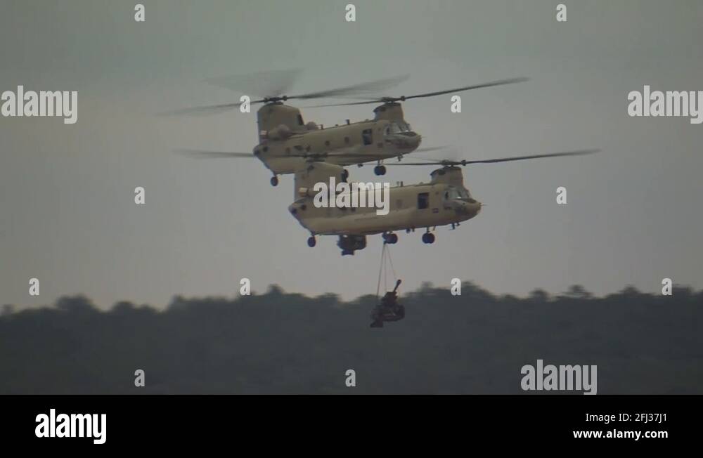 Boeing CH-47 Chinook lift howitzer in mid-air - 2018 Stock Video ...