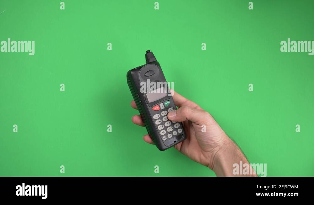 Using a 80s 90s Cell Phone Green Screen Stock Video Footage - Alamy