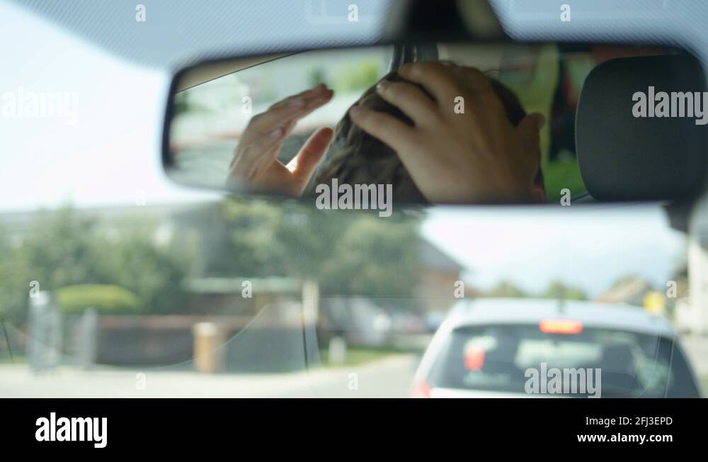 SLOW MOTION: Reflection of frustrated young man yelling at car in front ...