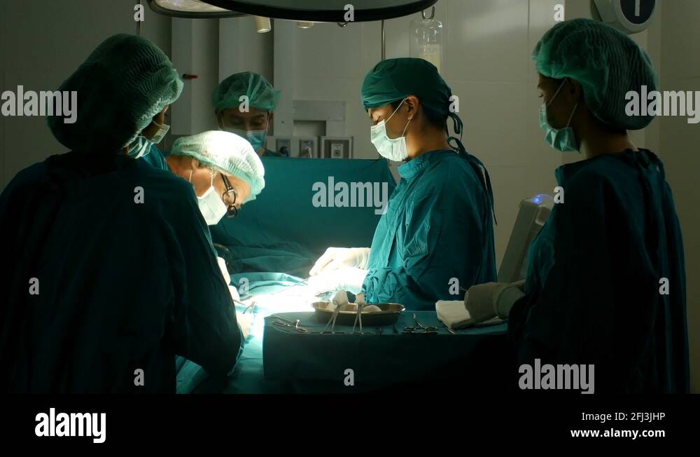The surgery team working together at the operating room in the hospital ...