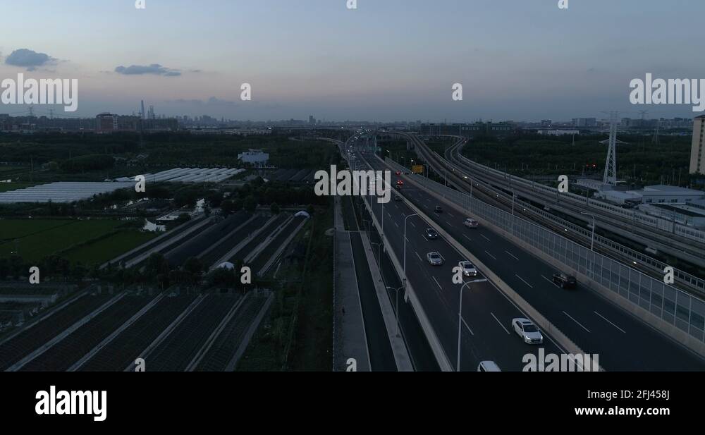 Drop down shot next to a double-level highway, where constant vehicles ...