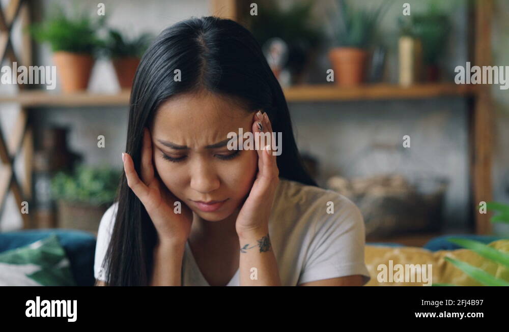 Beautiful asian woman suffering from Stock Videos & Footage - HD and 4K Video Clips - Alamy