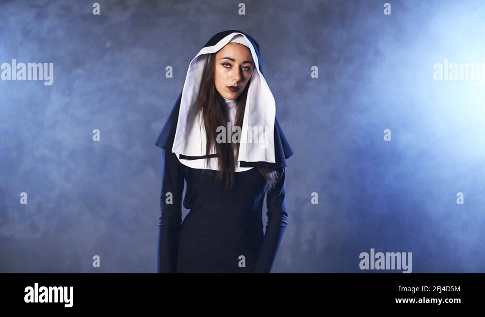 Nun shows the middle finger of the hand Stock Video Footage - Alamy