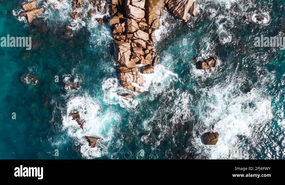 Where land meets the sea. This is an aerial view of waves breaking on ...