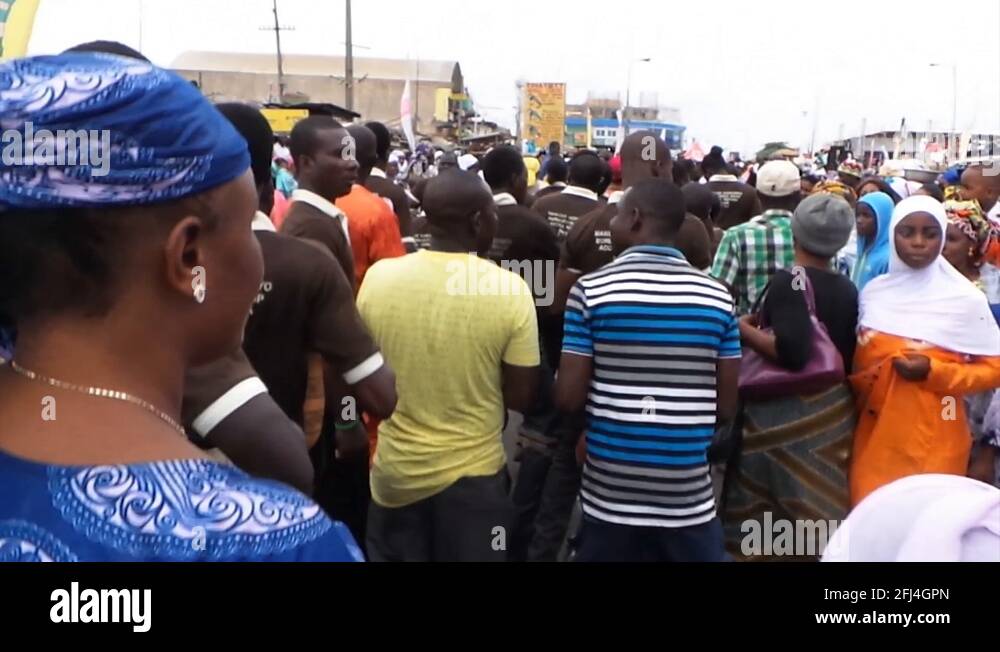 ewe people in Nima celebrating waving and dancing on the street of Nima ...