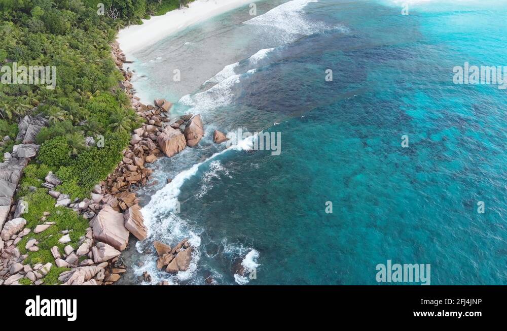 Where land meets the sea. This is an aerial view of waves breaking on ...
