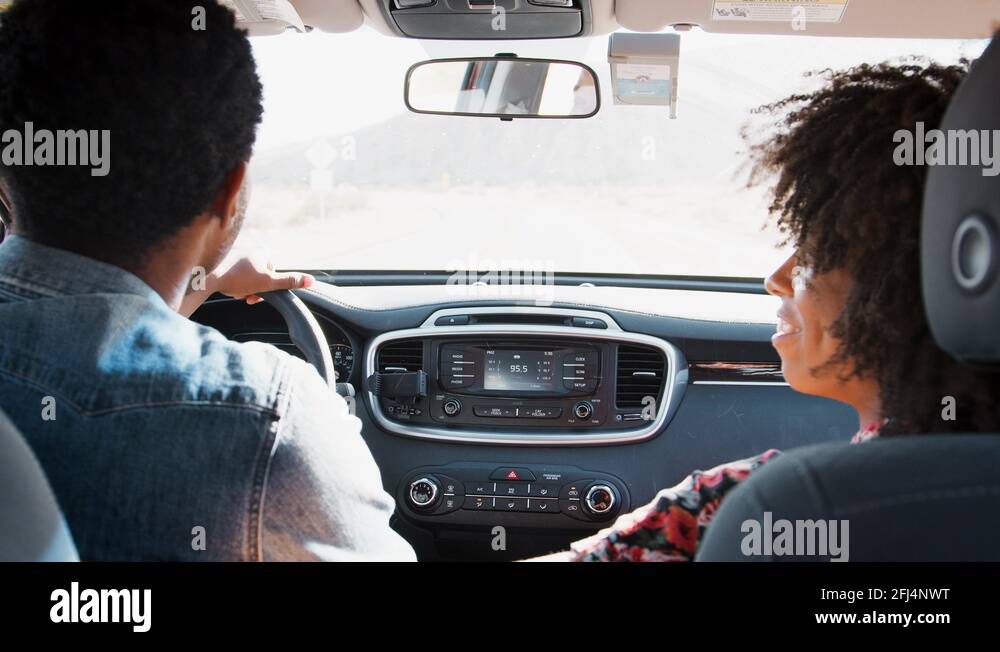 Happy young black couple driving car, back view, close up Stock Video ...