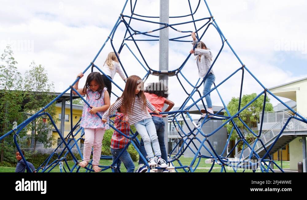 Elementary school kids climbing in the school playground Stock Video ...