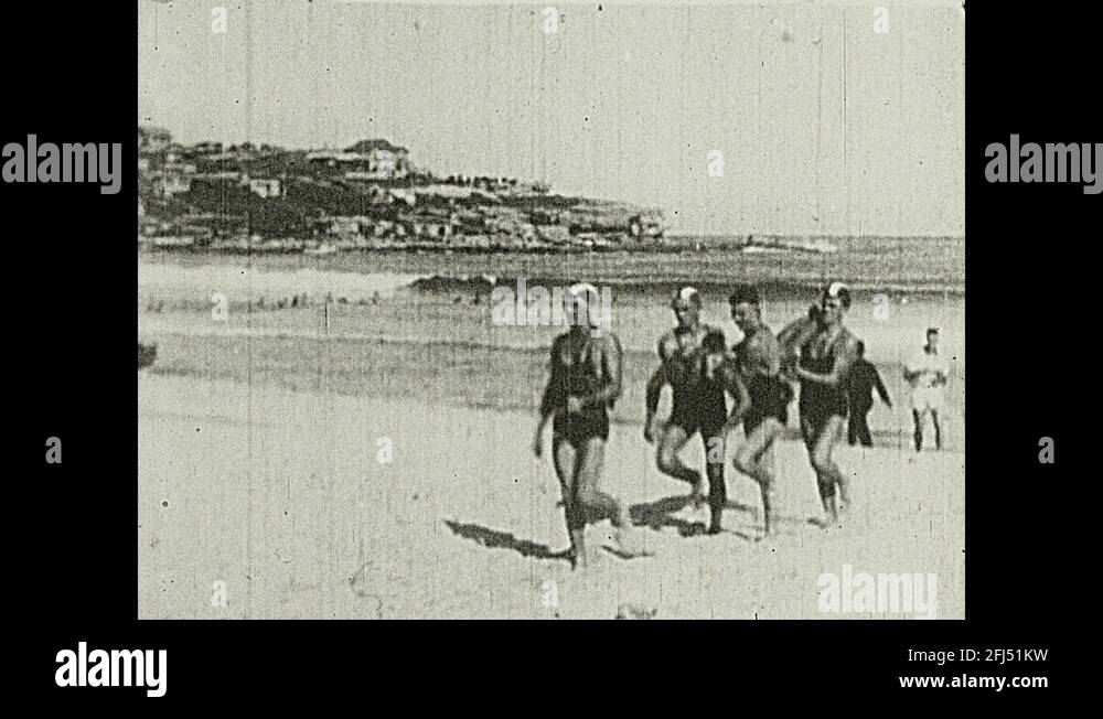 1930s: AUSTRALIA: lifeguards on beach. Men in swimwear on sand ...