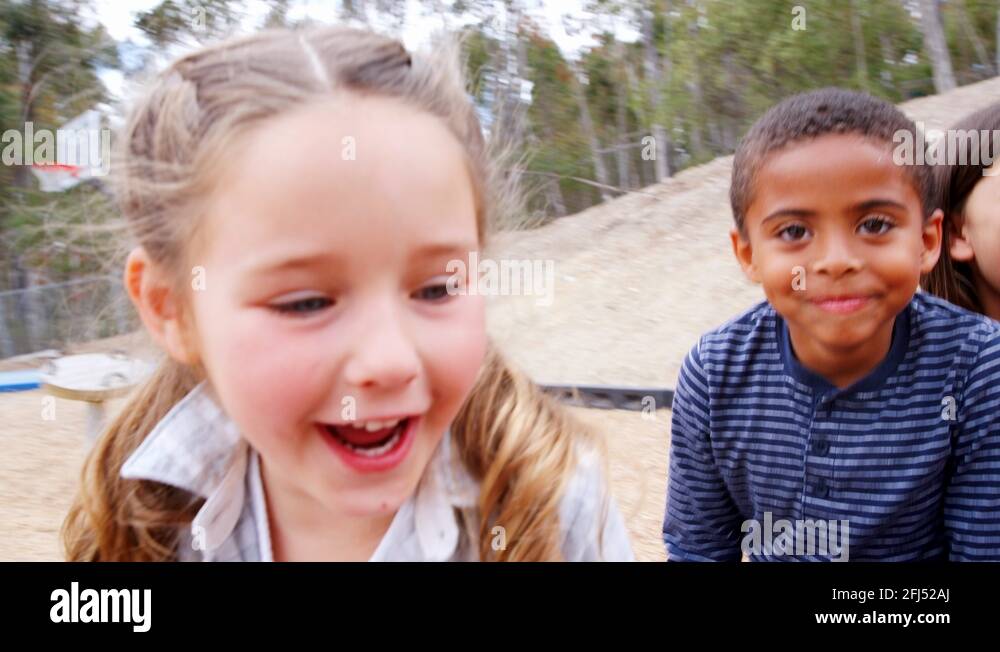 Elementary school kids spinning backwards in a playground Stock Video ...