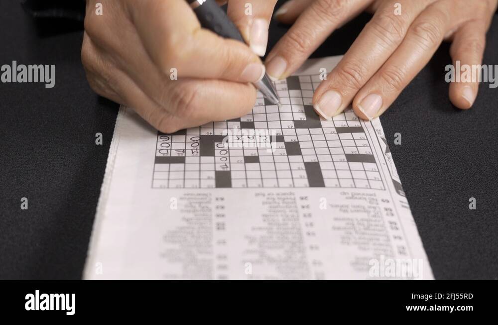 Front View-writing crossword Puzzle with a pen 4k Stock Video Footage ...