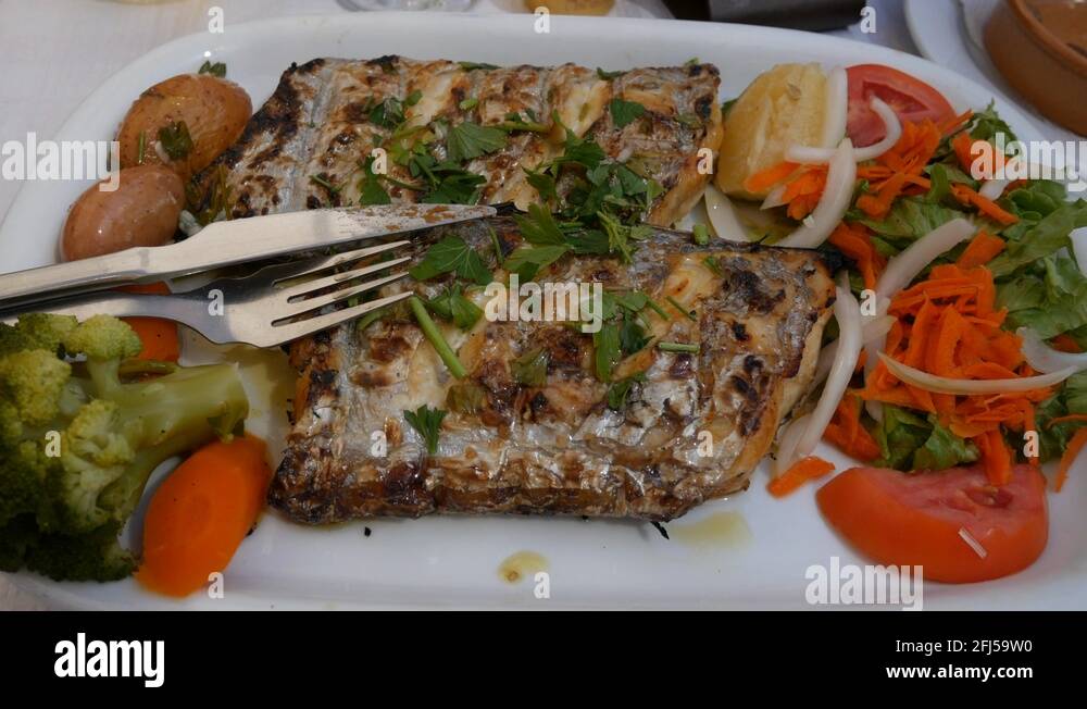 Grilled fish salad Stock Videos & Footage - HD and 4K Video Clips - Alamy