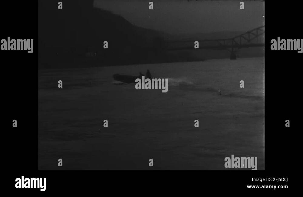 Engineers build steel treadway pontoon bridge over the Rhine - 1945 ...