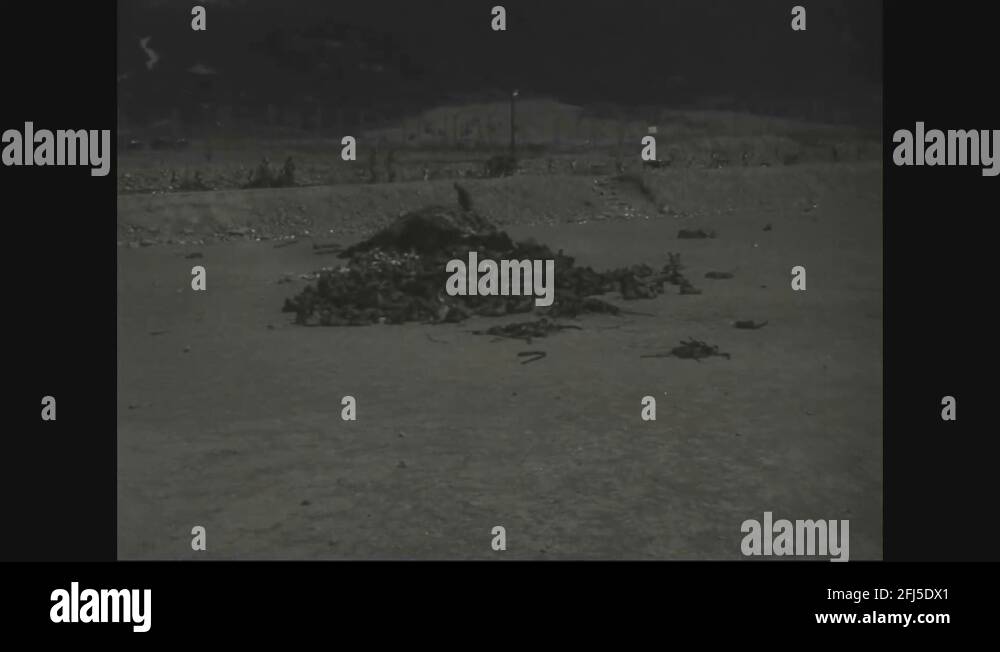 Scenes of pile of unserviceable clothes and PWs march toward the ...