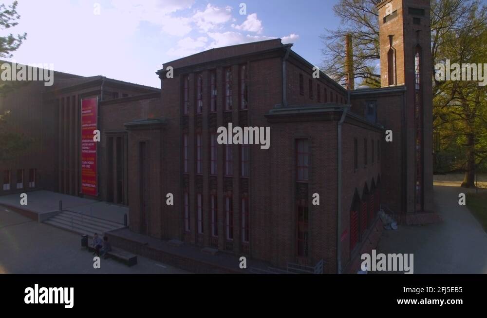A reverse shoot of a factory building from nearing backwards showing a ...