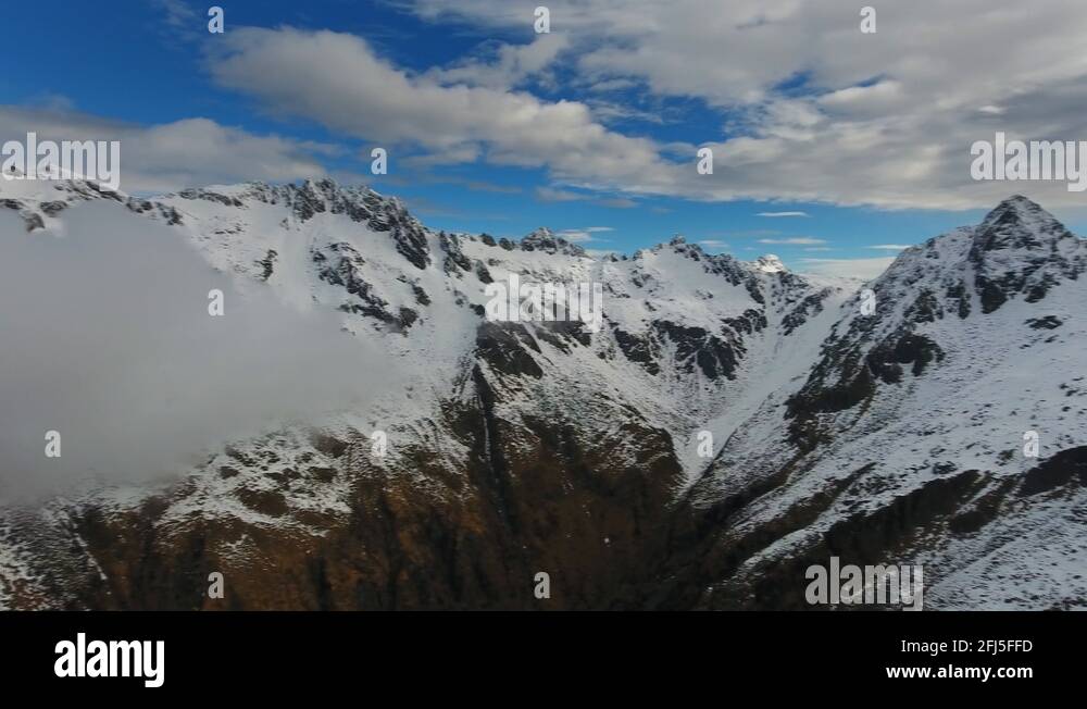 Snow capped mountains in clouds Stock Videos & Footage - HD and 4K ...