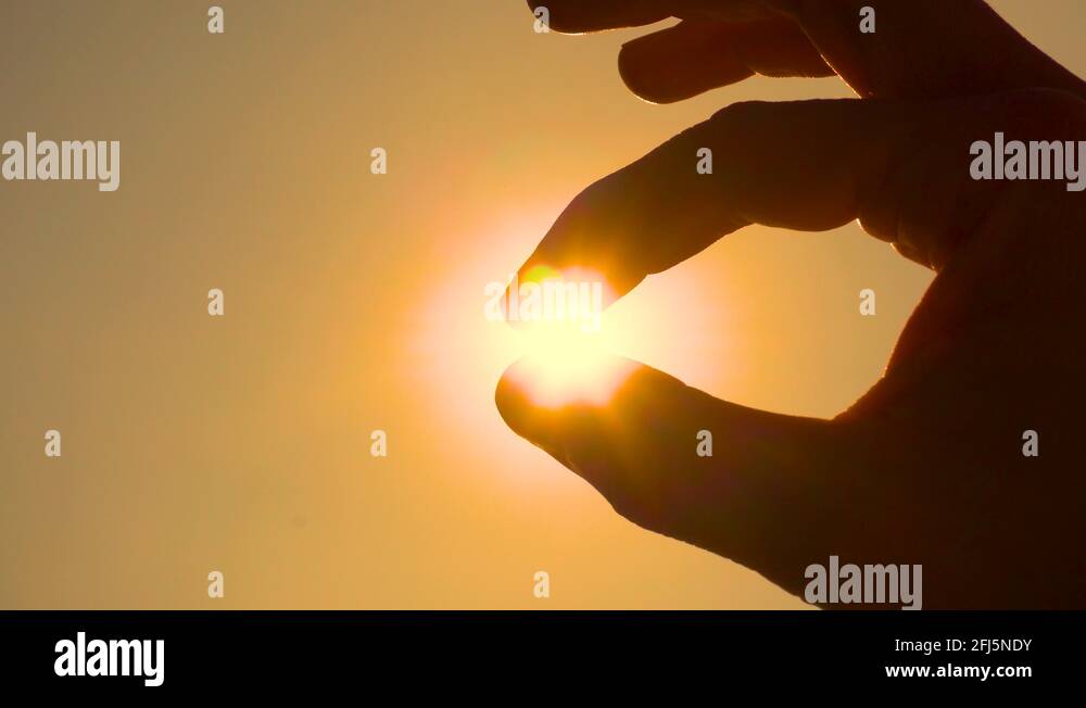 Sun in fingers sunset close Stock Videos & Footage - HD and 4K Video ...