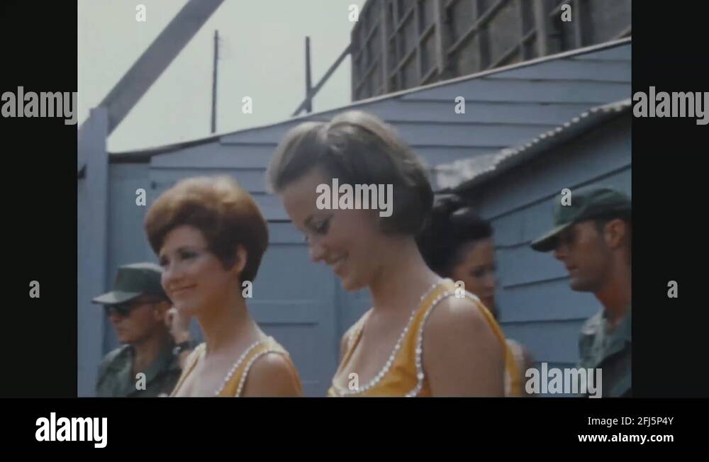 Girls led by Miss America walk down center aisle in Miss America USO ...