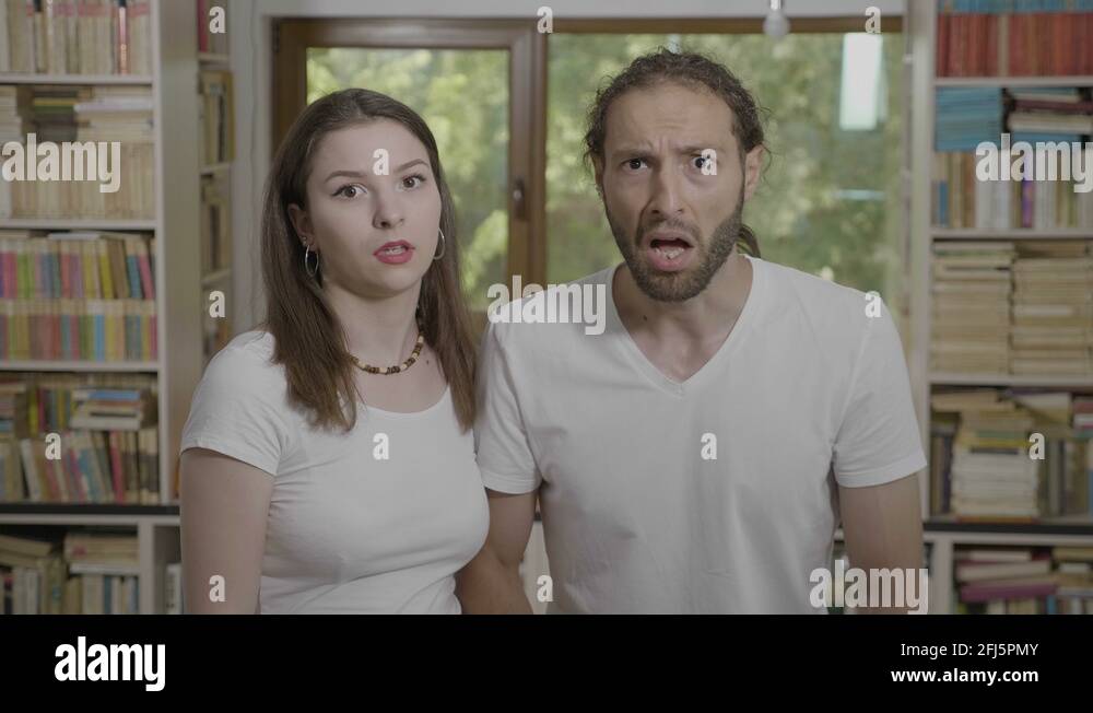 Jaw dropping reaction from teenage couple watching something scary and ...