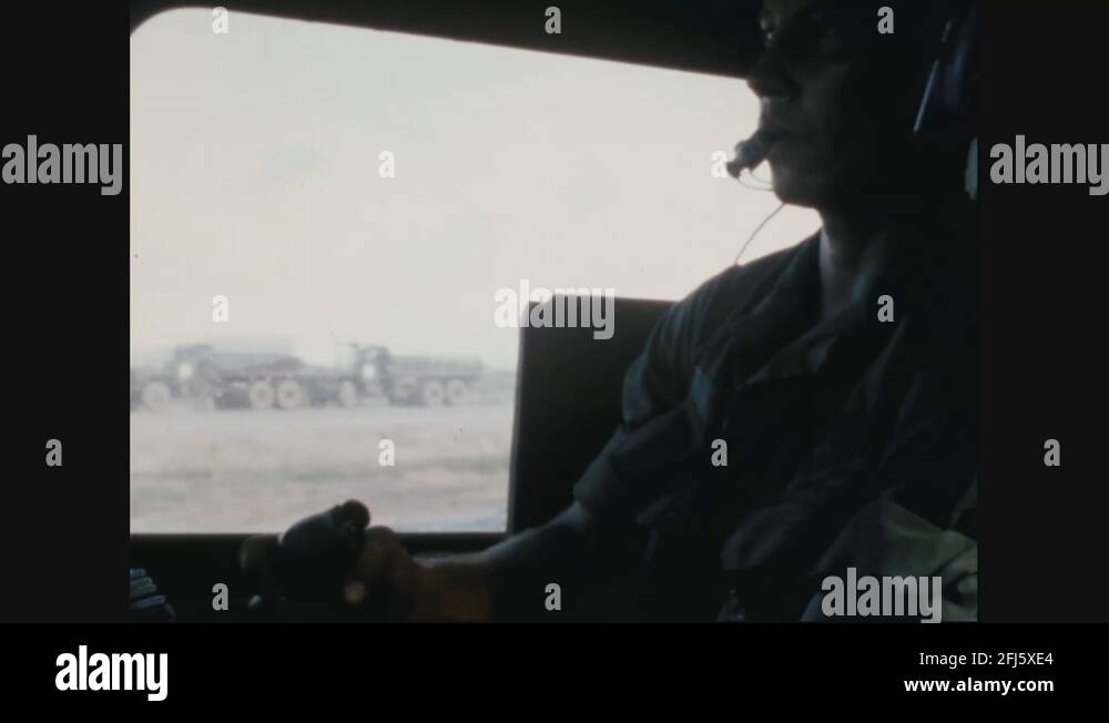 Soldier at controls of ACV craft as it moves along ramp to river - 1968 ...