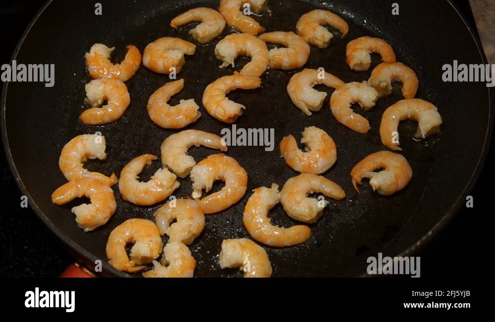Cooking shrimp. Man frying shrimp. Chef cooking shrimp Stock Video ...