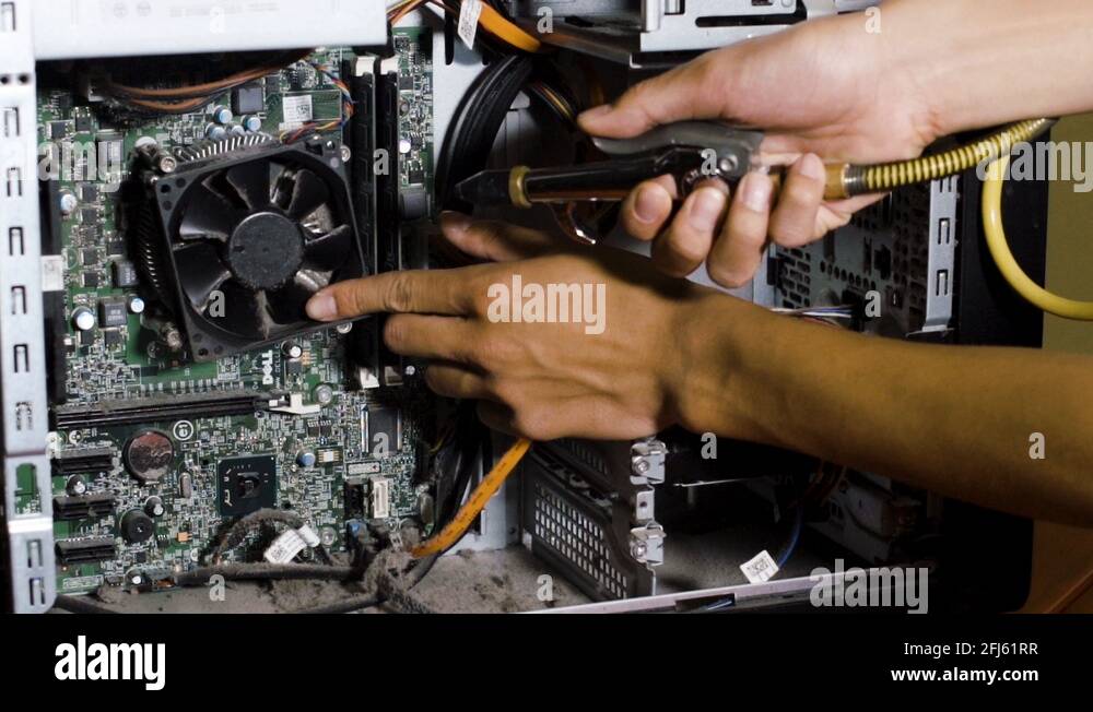 Cleaning dirty PC motherboard and fan with industrial air blower. Super ...