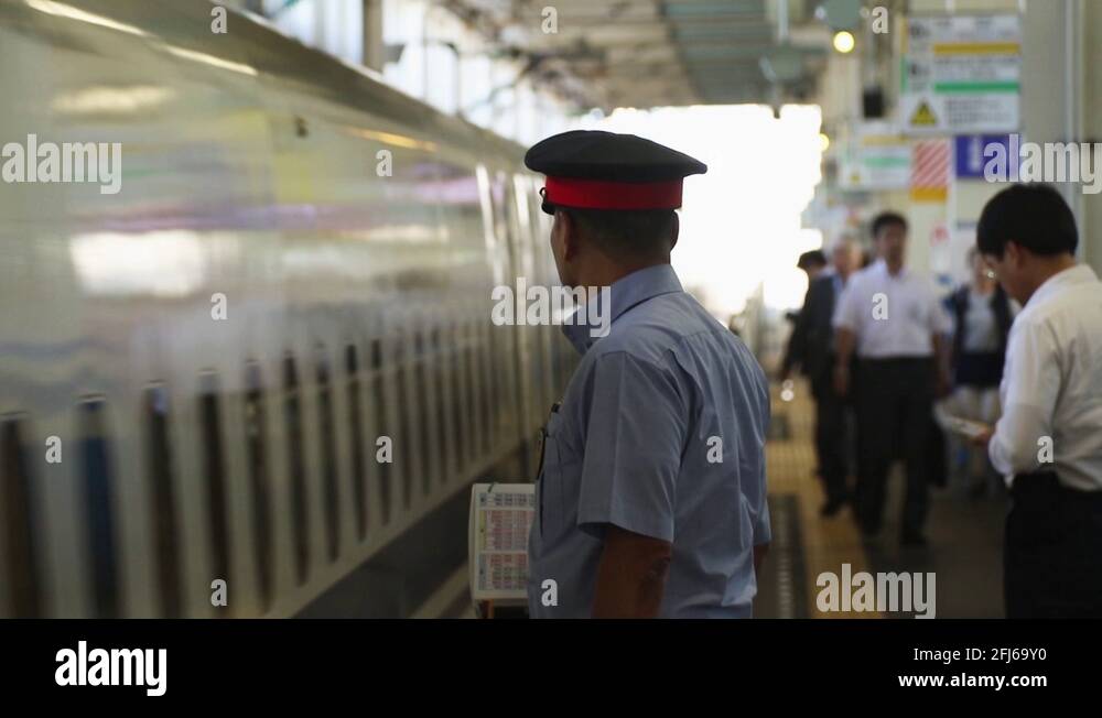 Bullet Train Guard on Platform as Shinkansen Bullet Train Leaves ...