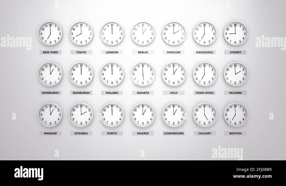 Round clocks with white body show different time zones on white wall ...