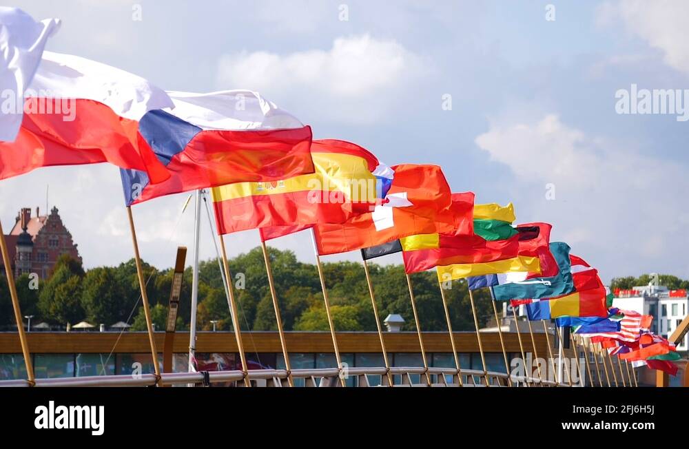 Flags of many nations waving together in a display of unity, slow ...