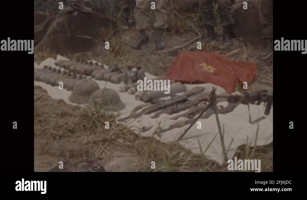 Scene of captured weapons and equipment laid out on the ground - 1969 ...
