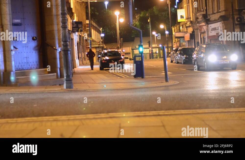 Town centre traffic and high street at night Stock Video Footage - Alamy