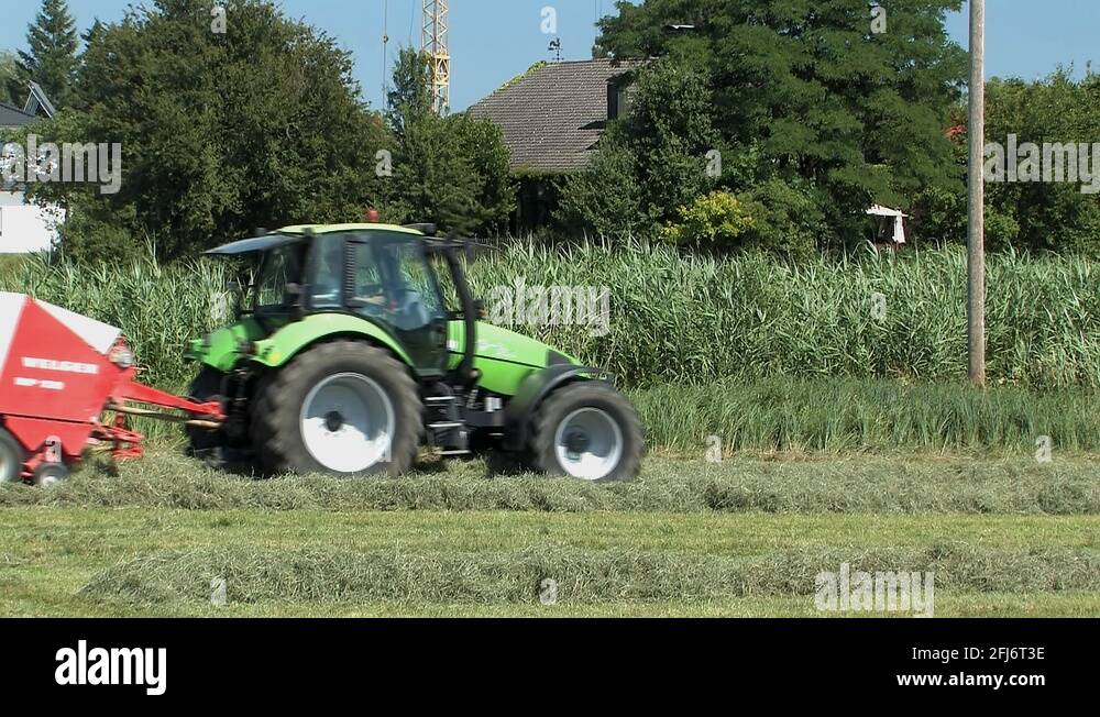 Hay harvest with tractor Stock Videos & Footage - HD and 4K Video Clips ...