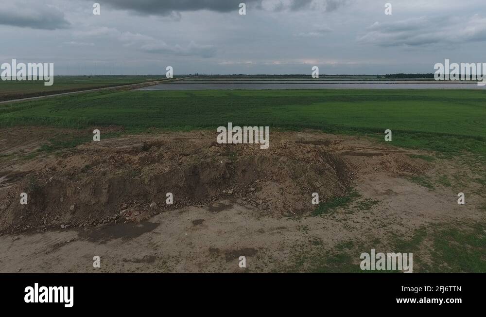 Flying over the hill of earth. cleaning the area of excess soil Stock ...