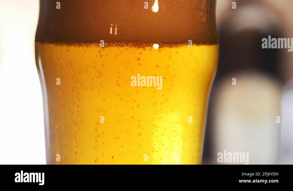Beer up close in a glass Stock Video Footage - Alamy
