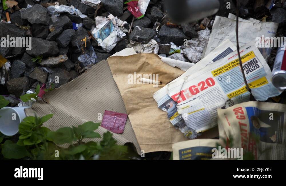 Dystopian G20 newspaper article in garbage trash pile, environmental ...