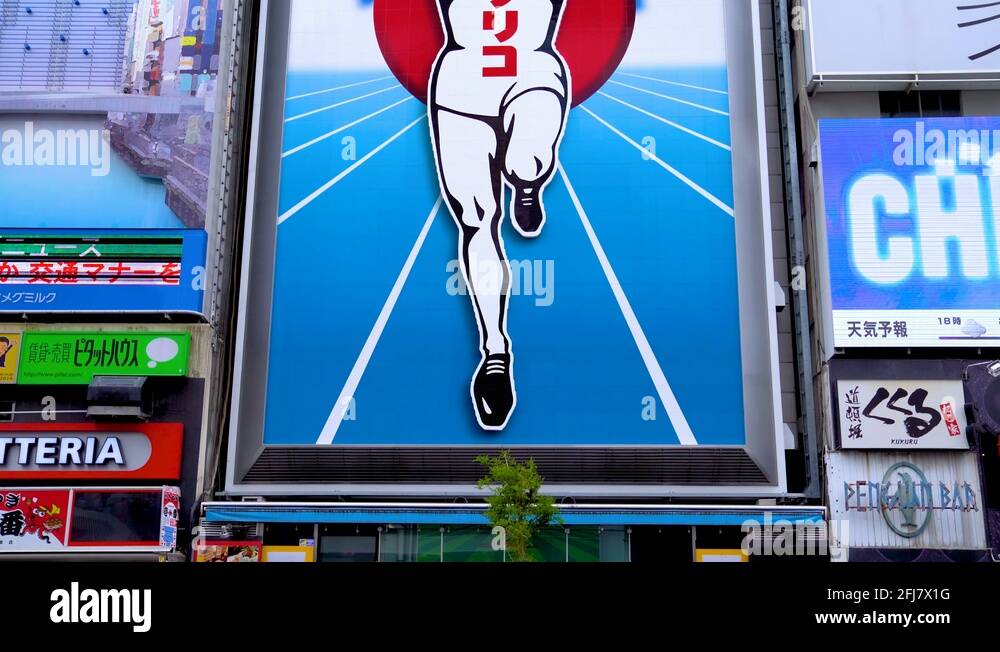famous Glico running man sign hanging on the wall Stock Video Footage ...