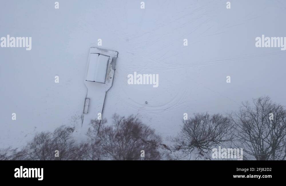 Overhead panning from right hand side revealing tiny shed on edge of ...