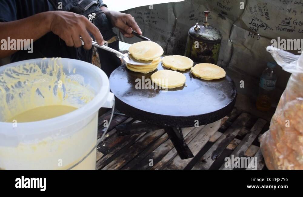A person cooking up yummy hot cake in the canteen in the philippines ...