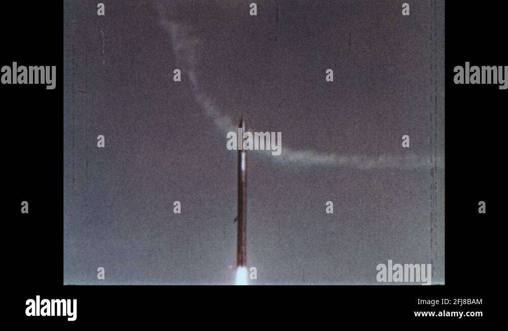 1960s: Rocket launches into night sky. Diagram shows lines from ...