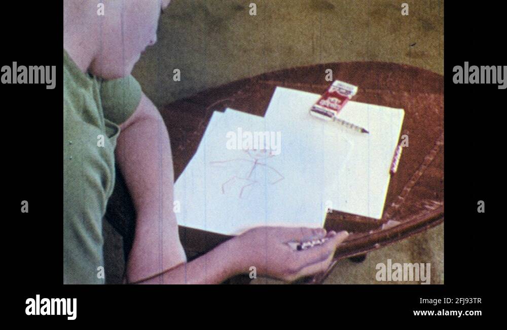 1960s: Boy draws stick figure. Backyard, boy uses wrench on lawnmower ...