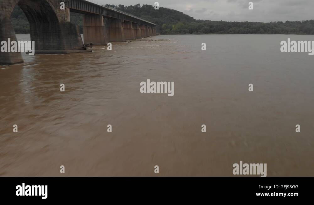Flying near the water next to historic train bridge in Lancaster Stock ...