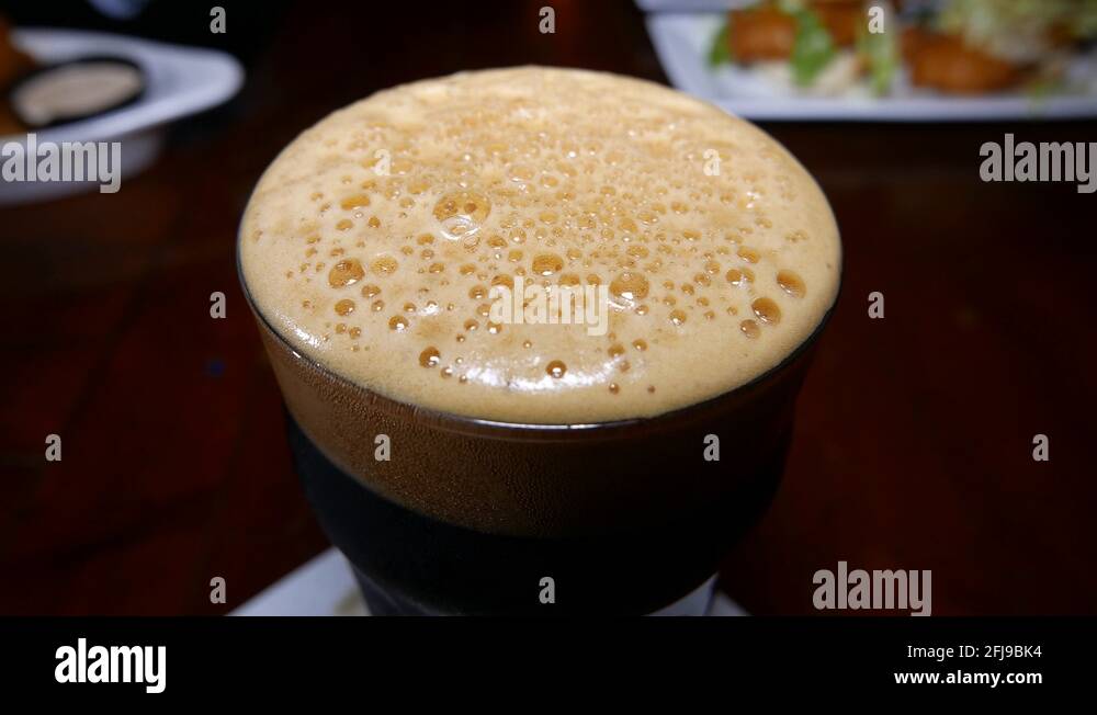 Foam head on beer Stock Videos & Footage - HD and 4K Video Clips - Alamy