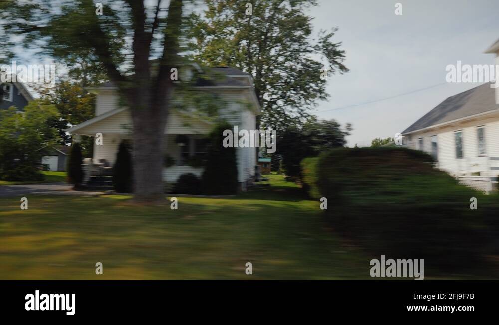 Ride along typical American suburbs. View from the window of the car ...