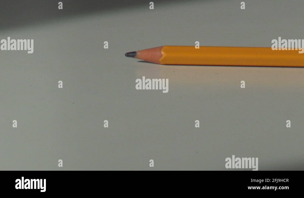 wooden pencil rolling on an office Desk Stock Video Footage - Alamy