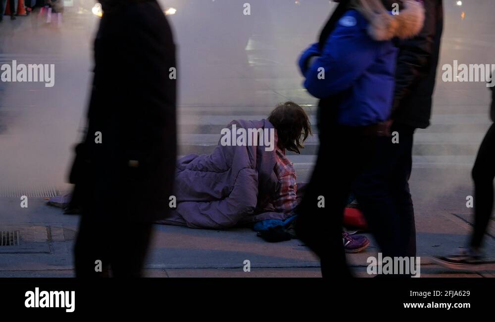 Homeless Man Tries to Stay Warm Near Steam Vent in Downtown Toronto ...